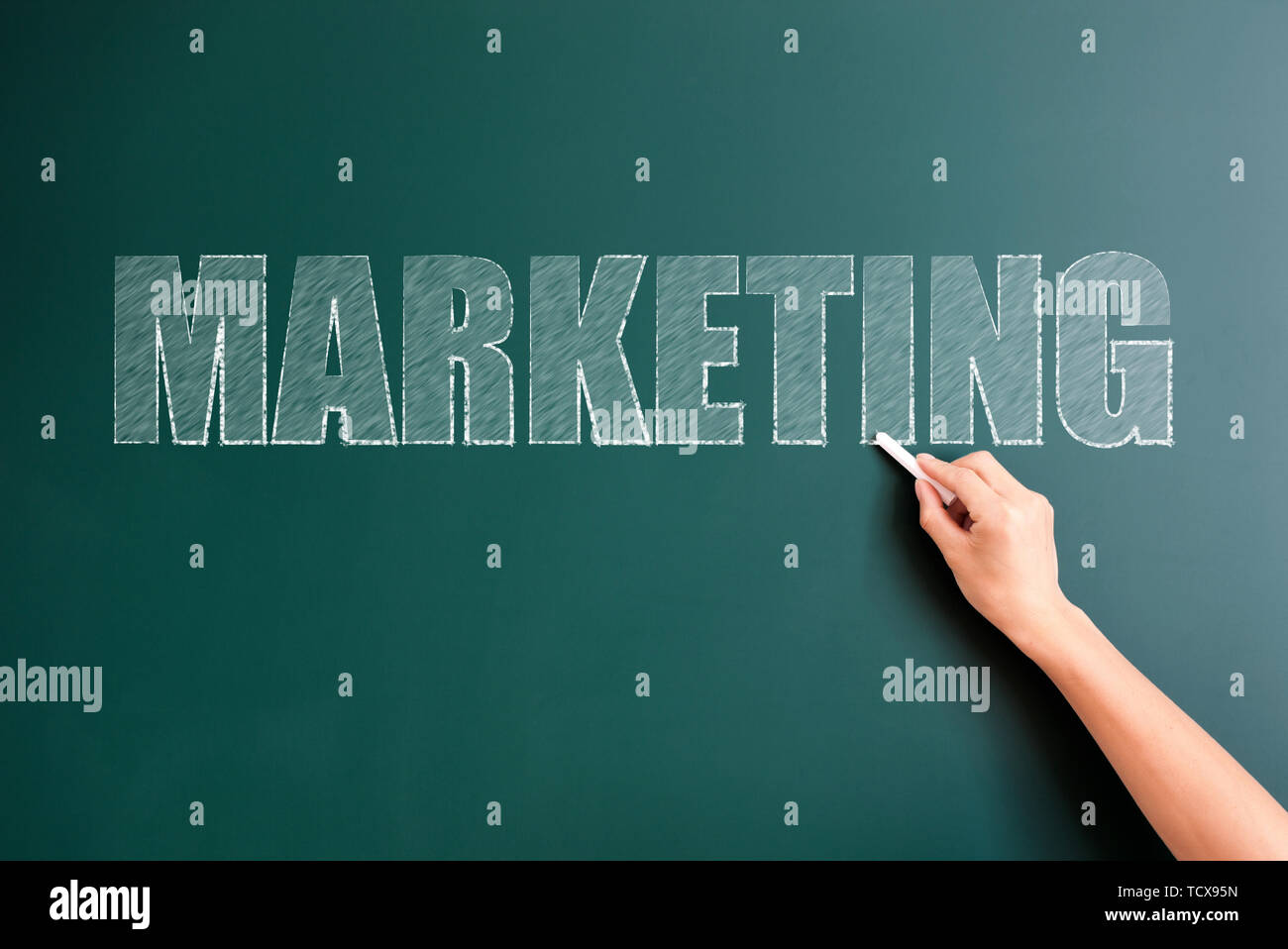 Marketing written on blackboard Stock Photo - Alamy
