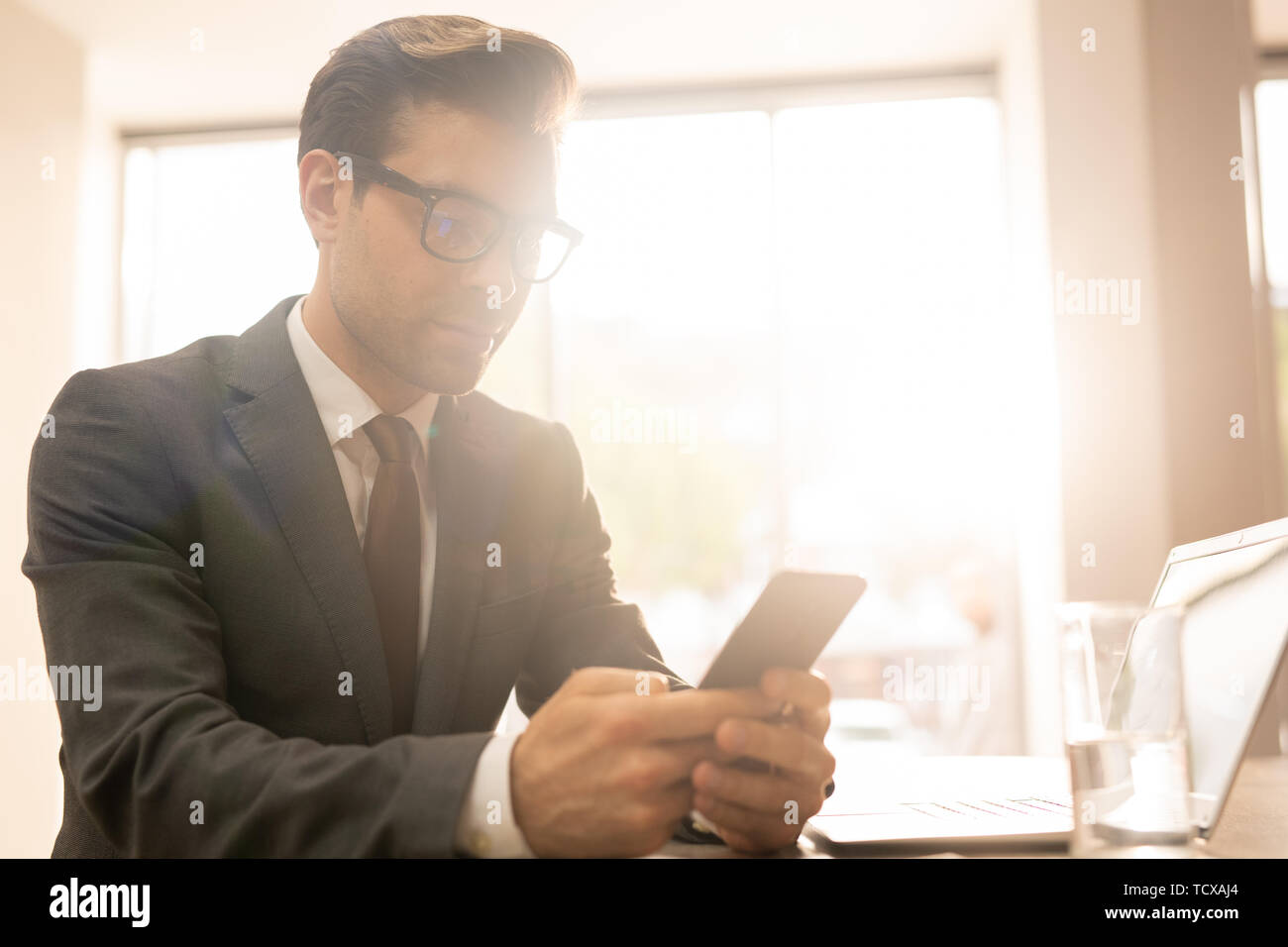 Texting in working chat Stock Photo - Alamy