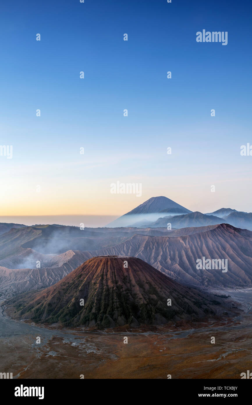 View over volcanic peaks and lava landscapes around Mount Bromo at dawn ...