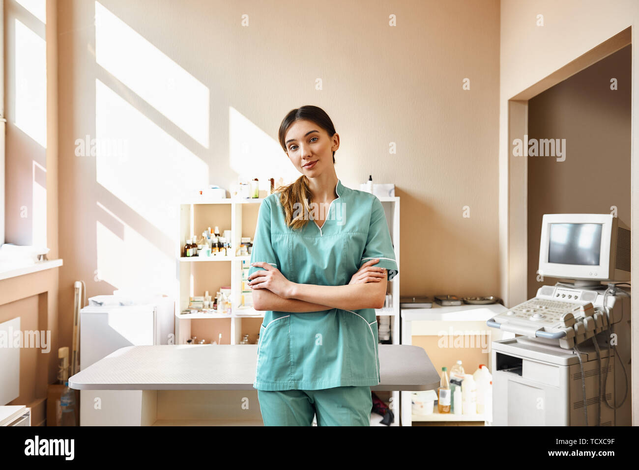 Professional doctor. Portrait of kind and young female veterinarian in ...