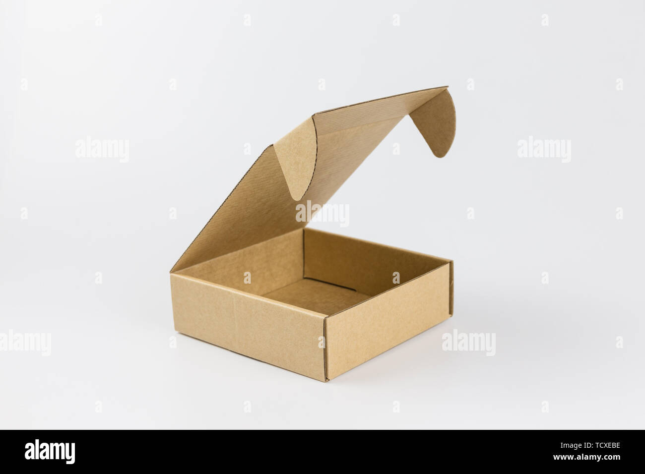 isolated yellow paper box on white background Stock Photo - Alamy