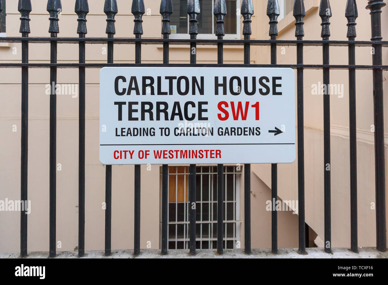 Roadside street name sign on iron railings for Carlton House Terrace ...