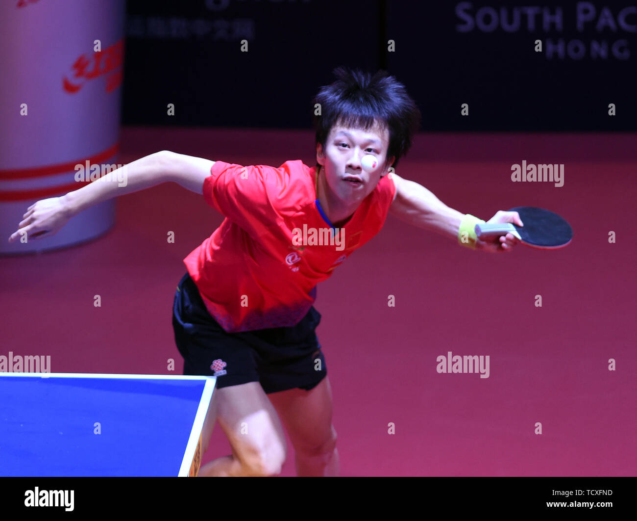 Lin Gaoyuan of China serves against Tomokazu Harimoto of Japan in the ...
