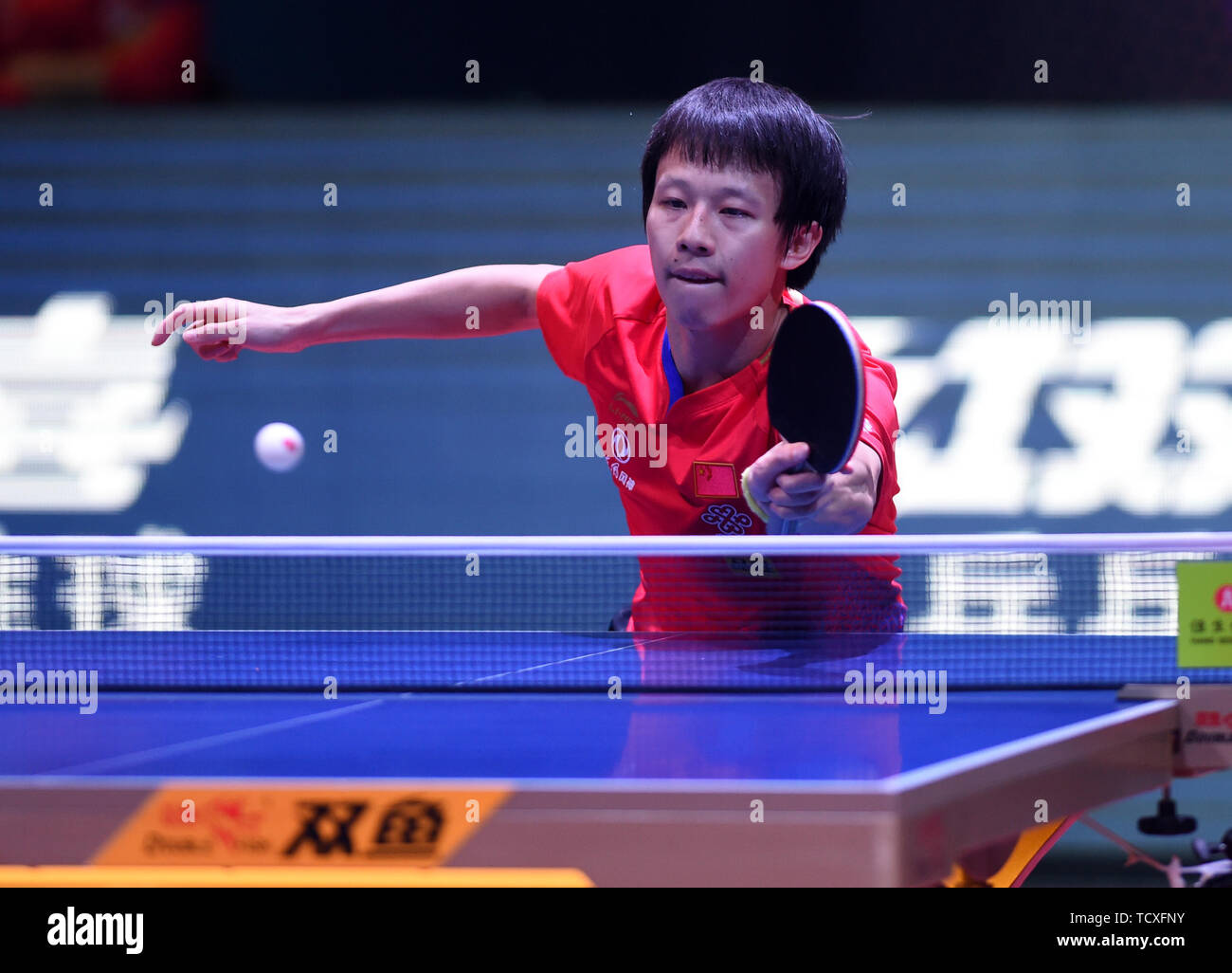 Lin Gaoyuan of China returns a shot to Tomokazu Harimoto of Japan in ...