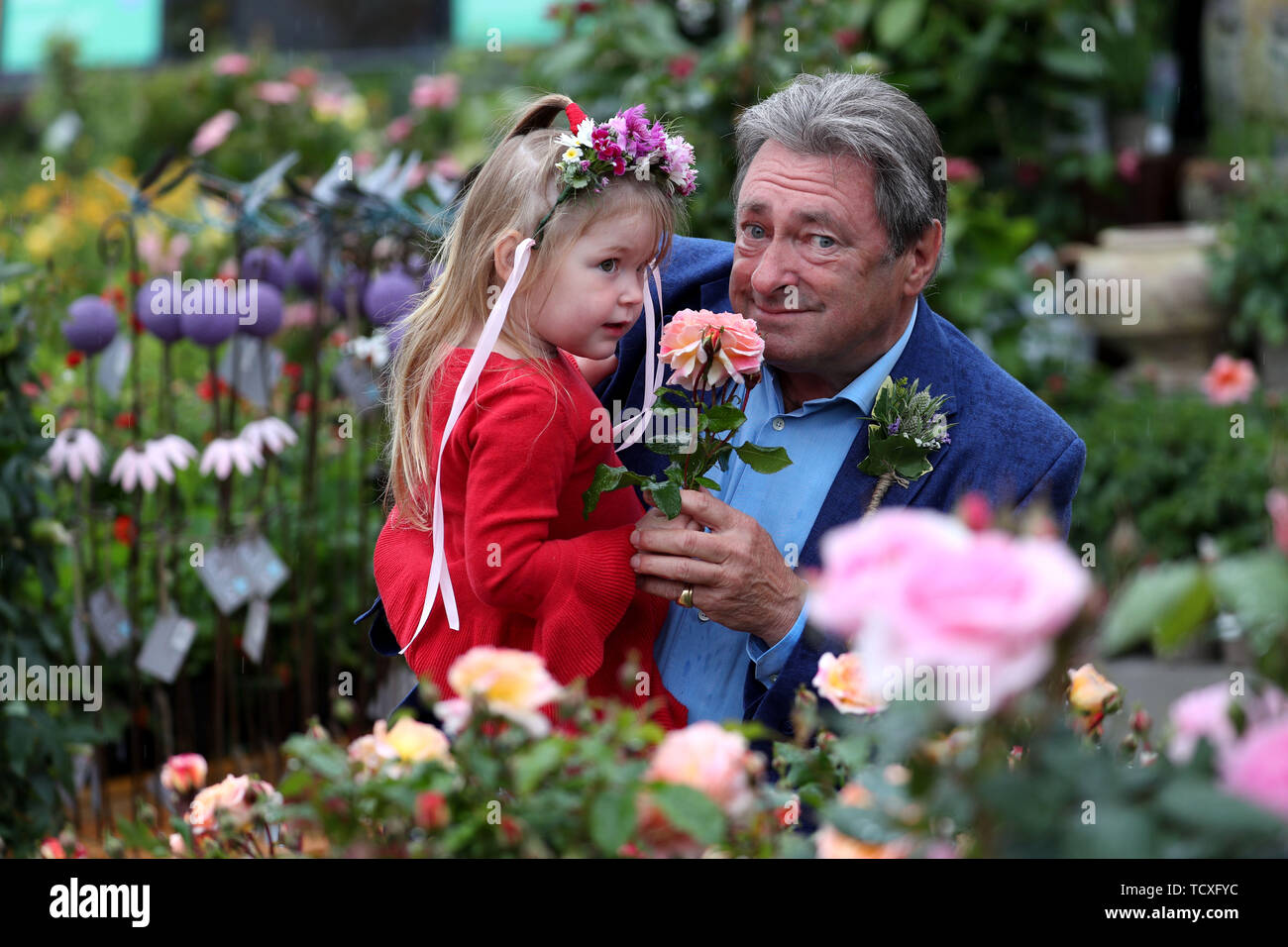 TV gardener Alan Titchmarsh holds 3-year-old Rosie O'Hare, before he ...