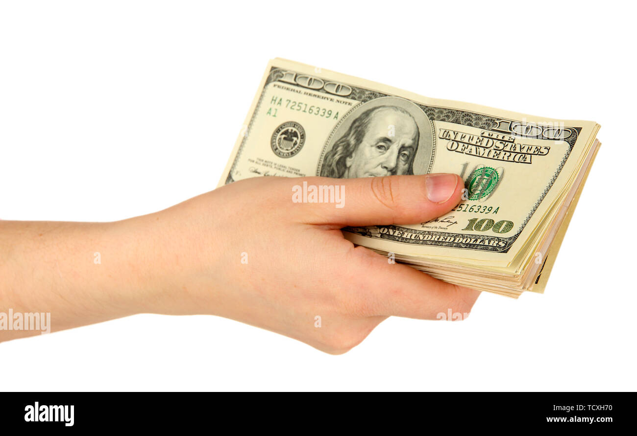 Stack of one hundred dollars banknotes in hand close-up isolated on ...