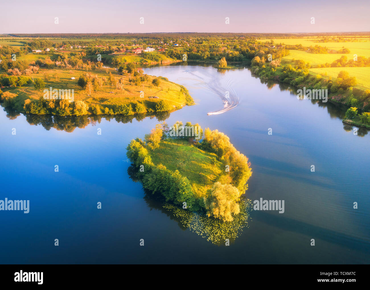 Aerial view of beautiful small island with green trees and boats Stock ...