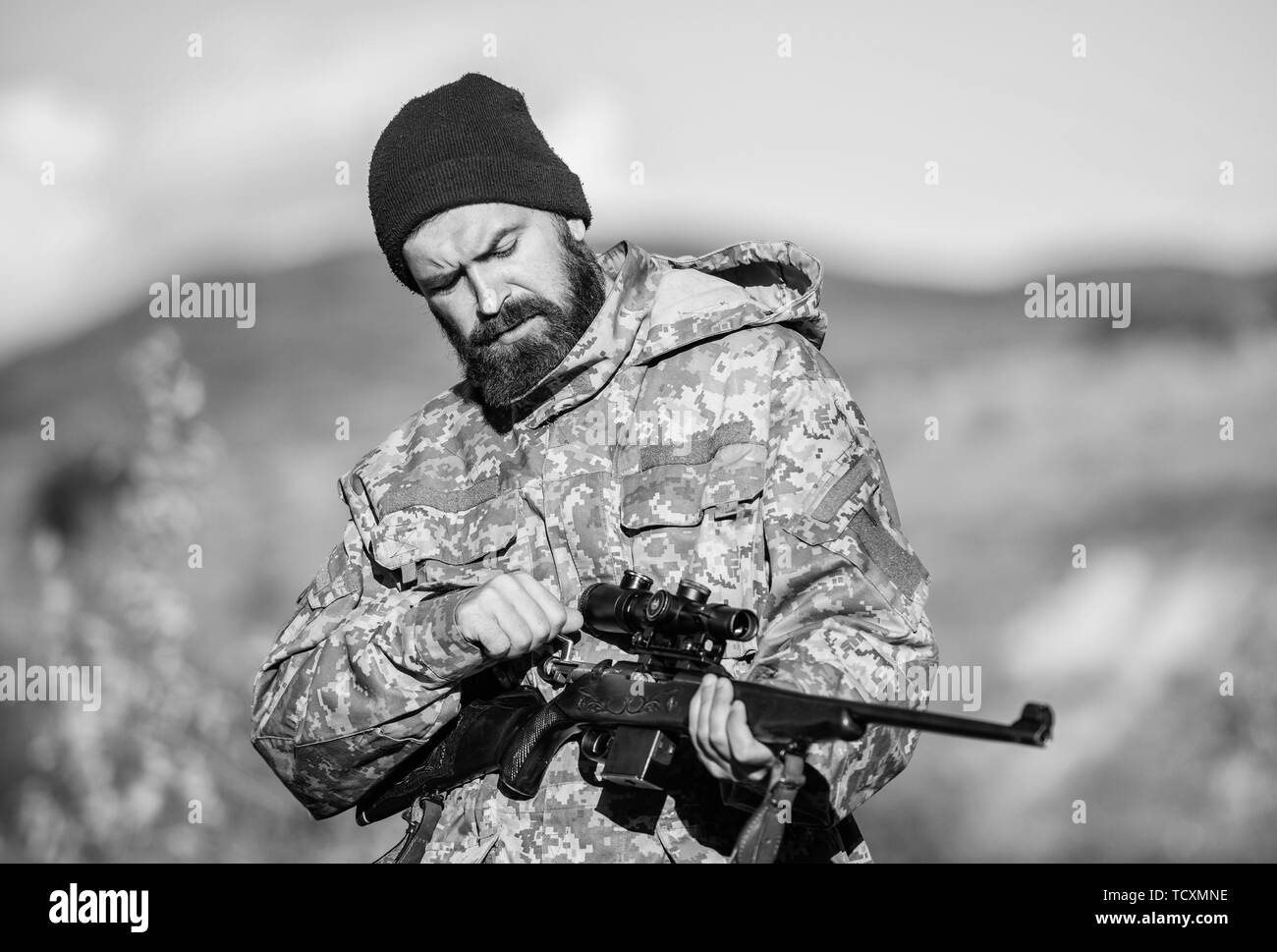 Focus and concentration of experienced hunter. Hunting and trapping ...