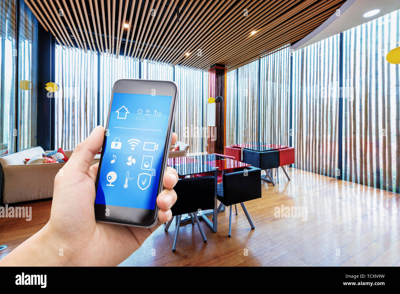 smart phone with smart home with modern lobby Stock Photo - Alamy