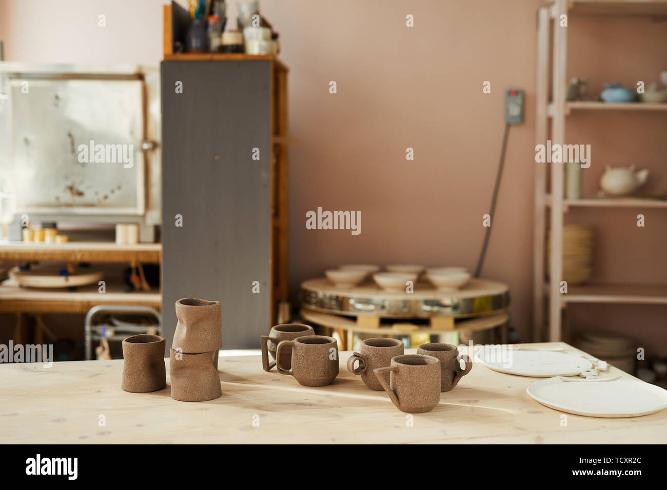 Background image of traditional pottery shop interior in sunlight, copy ...