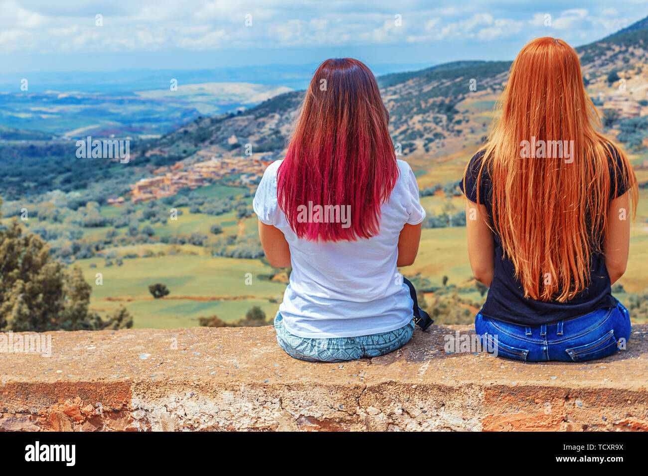 Two women woman female back backs hi-res stock photography and images ...