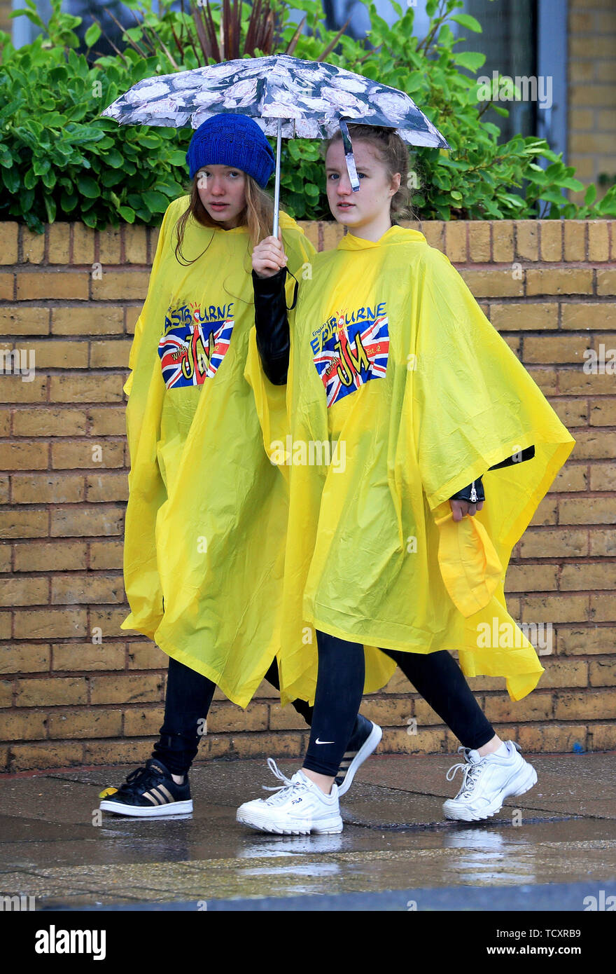 German exchange students brave torrential rain on promenade hi-res ...