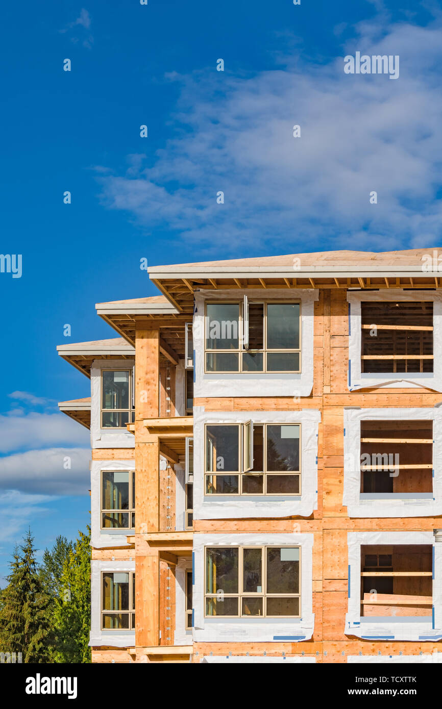 Roof corners, windows, and walls of new aparntment building under ...