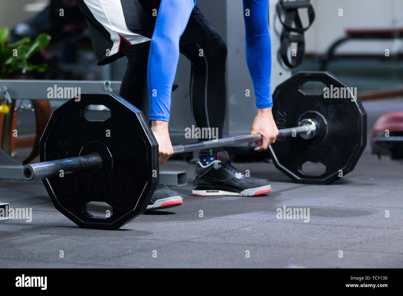 young asian man working out in modern gym Stock Photo - Alamy