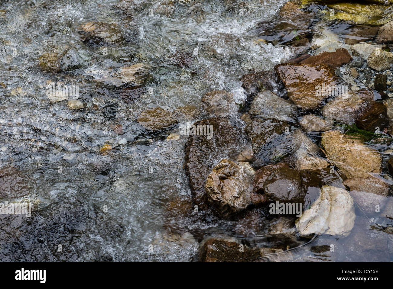 Stone in the creek Stock Photo - Alamy