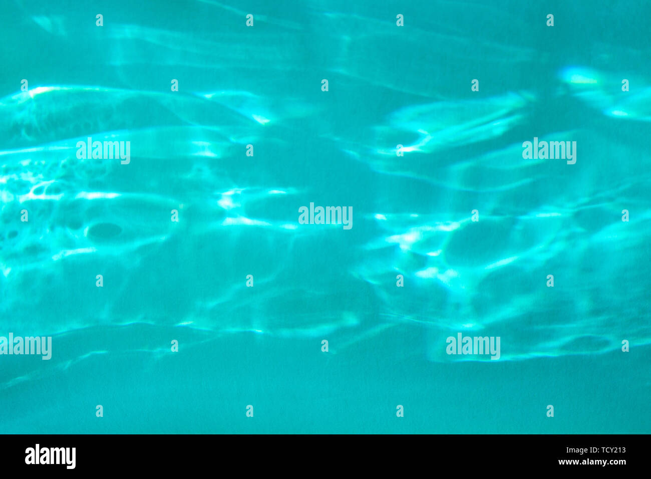 Trendy blue colored abstract background with light and shadows caustic ...