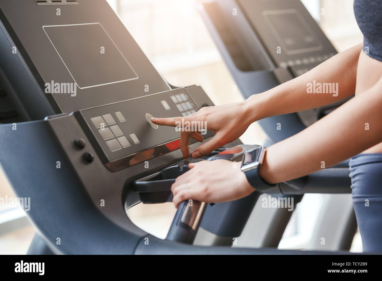 Woman on gym bike starting hi-res stock photography and images - Alamy