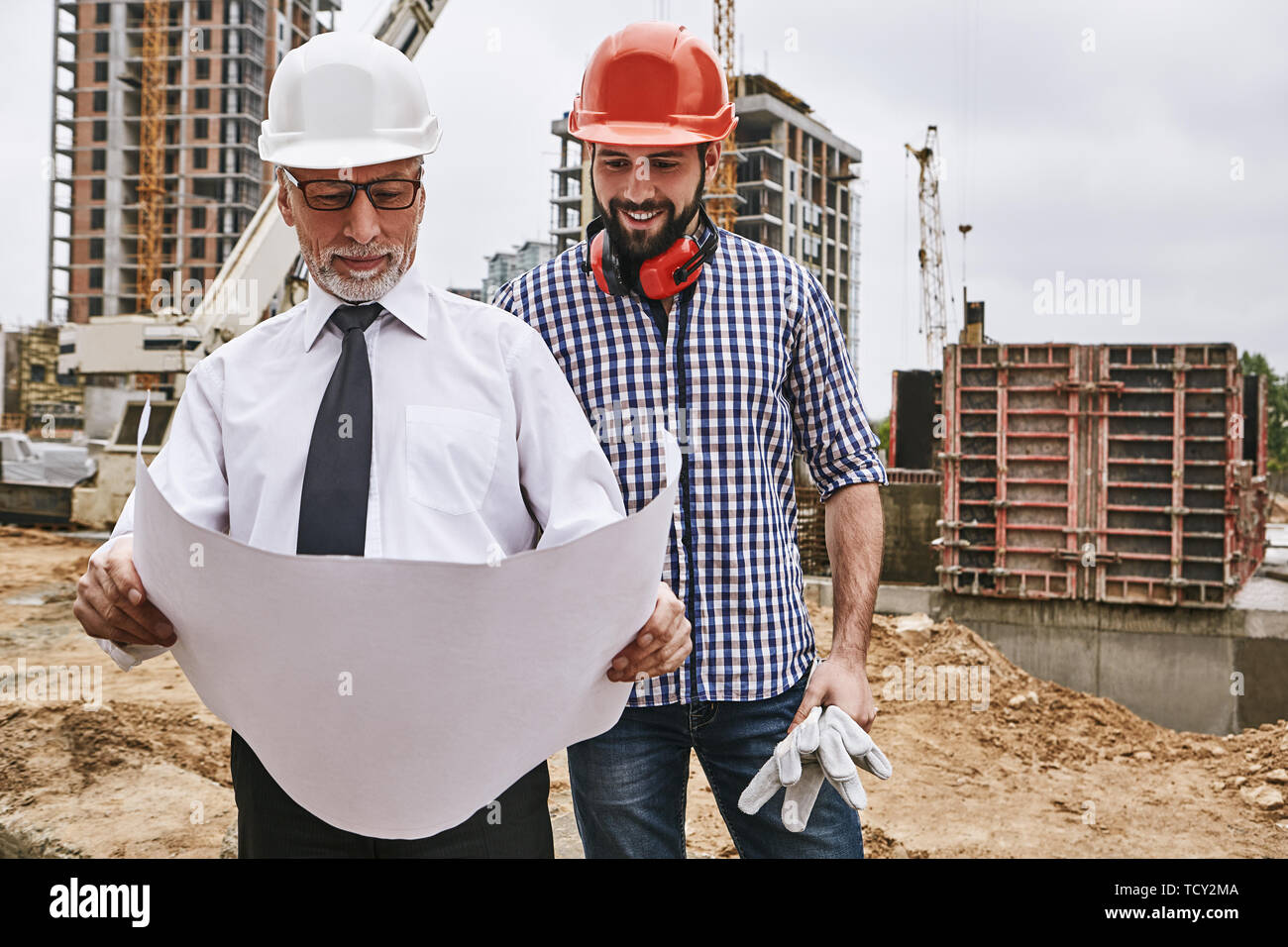 Perfect work. Main senior architect in formal wear and white helmet ...