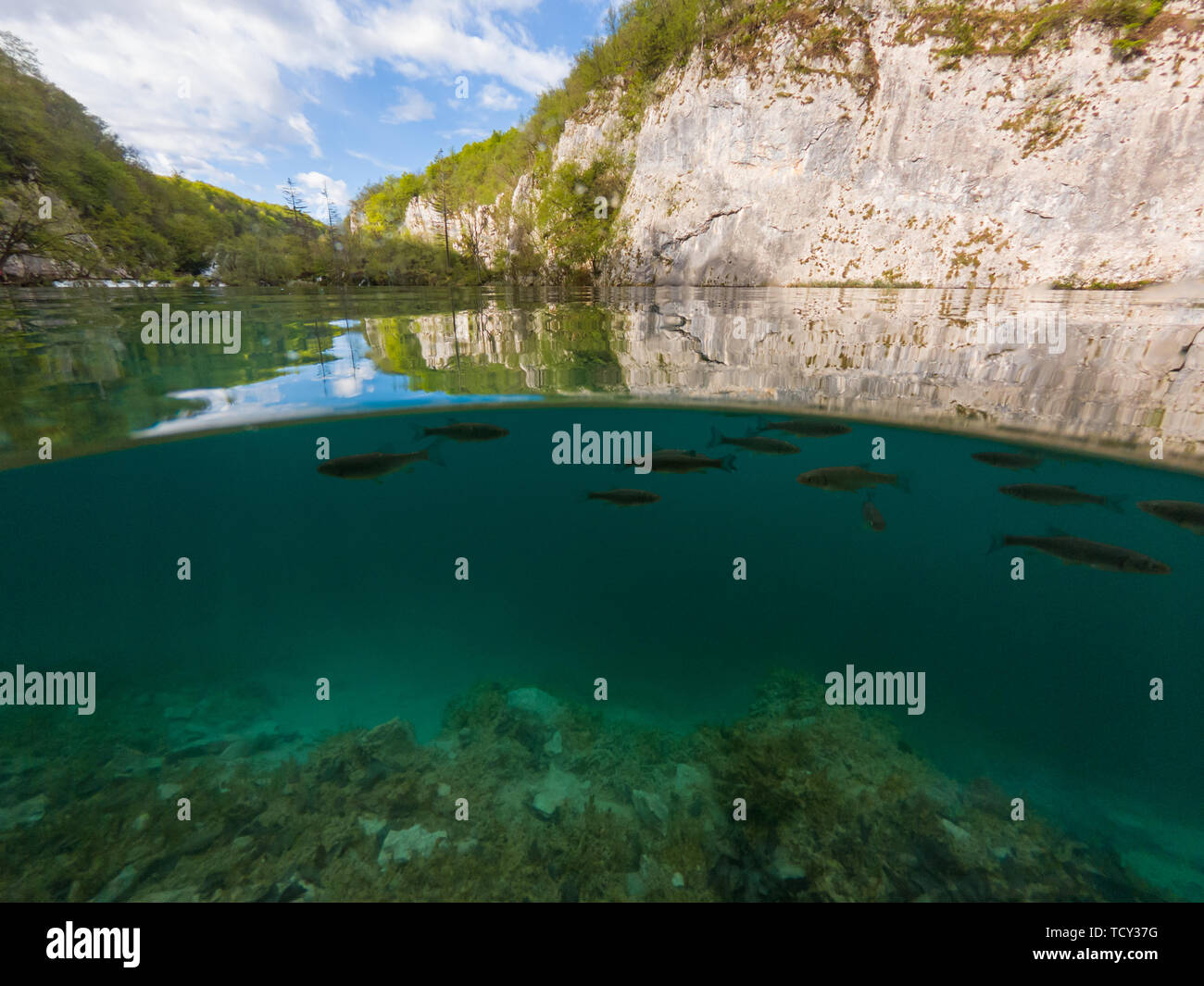 Amazing split view of waterfalls falling into lake Stock Photo - Alamy