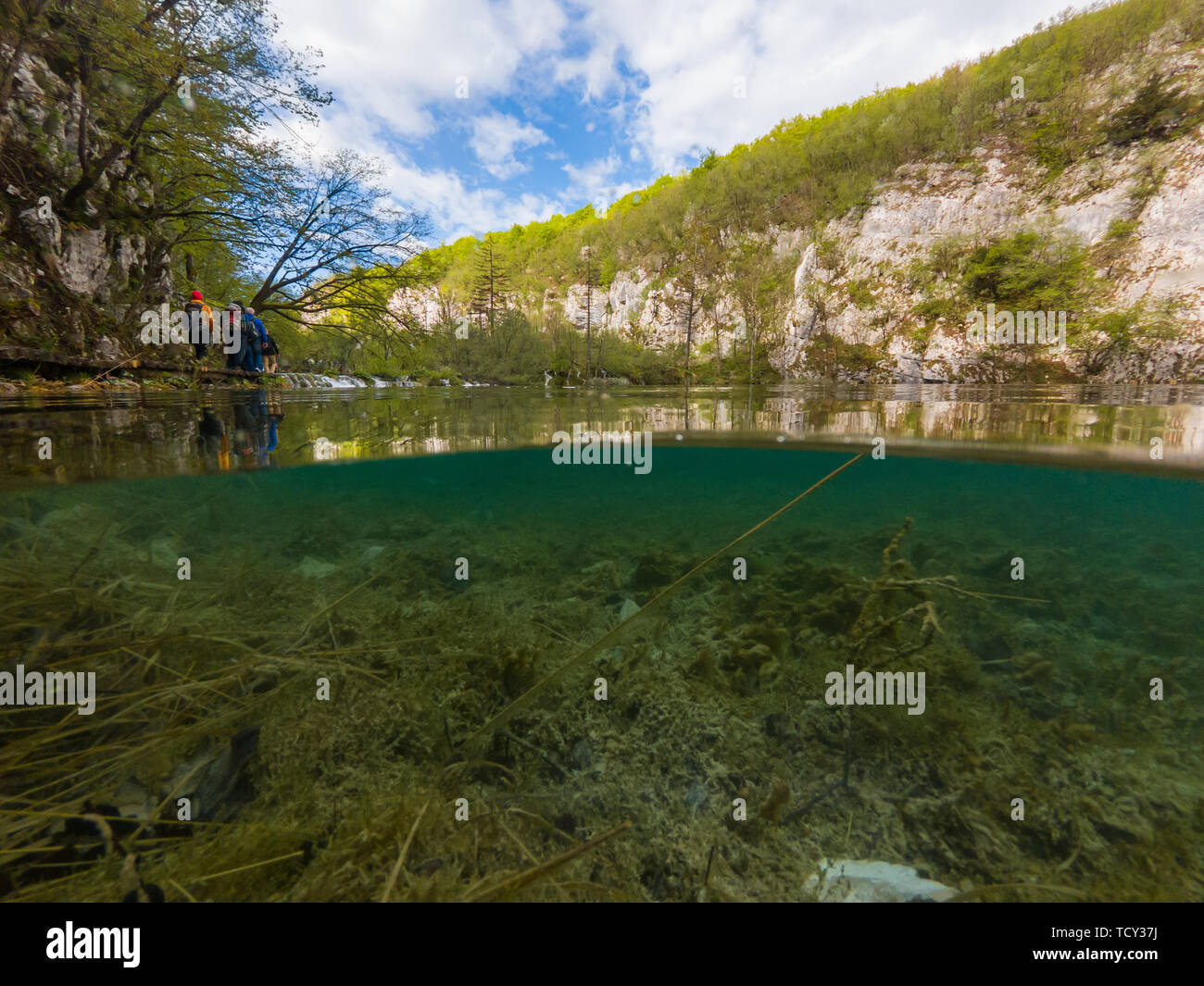 Amazing split view of waterfalls falling into lake Stock Photo - Alamy