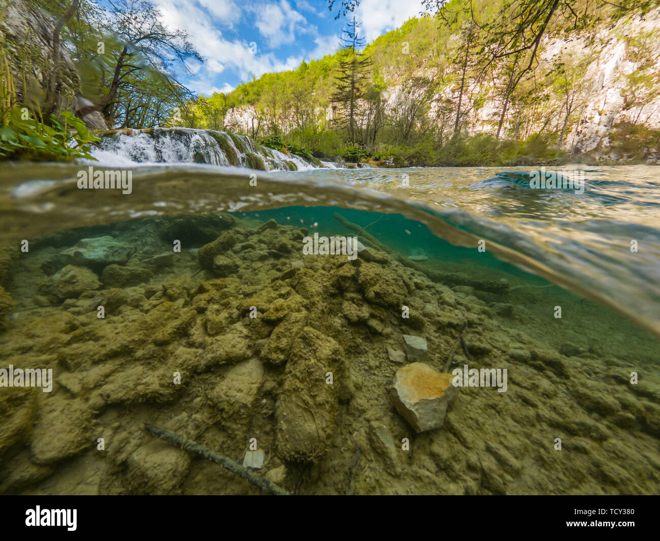 Amazing split view of waterfalls falling into lake Stock Photo - Alamy