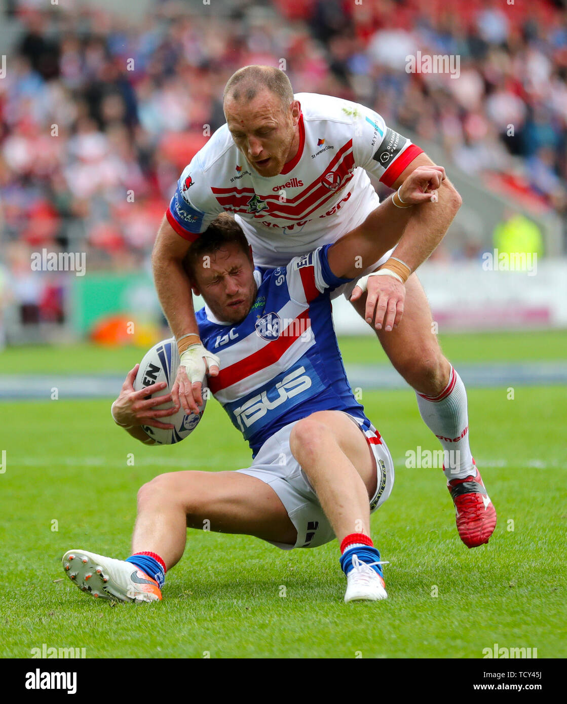 Wakefield Trinity's Kyle Wood (left) and St Helens' James Roby battle ...