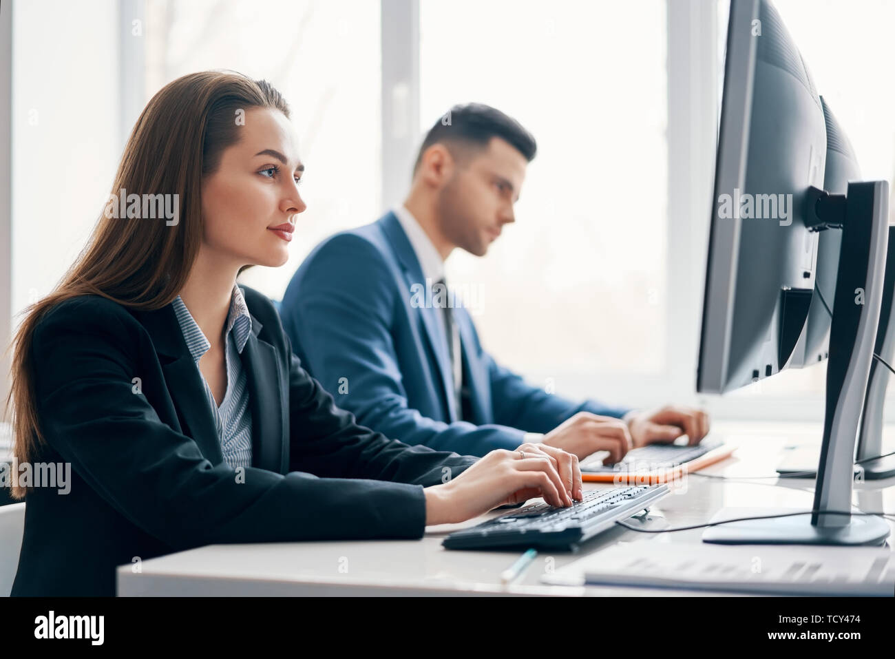 Business people working on computer in his workplace. Office life ...