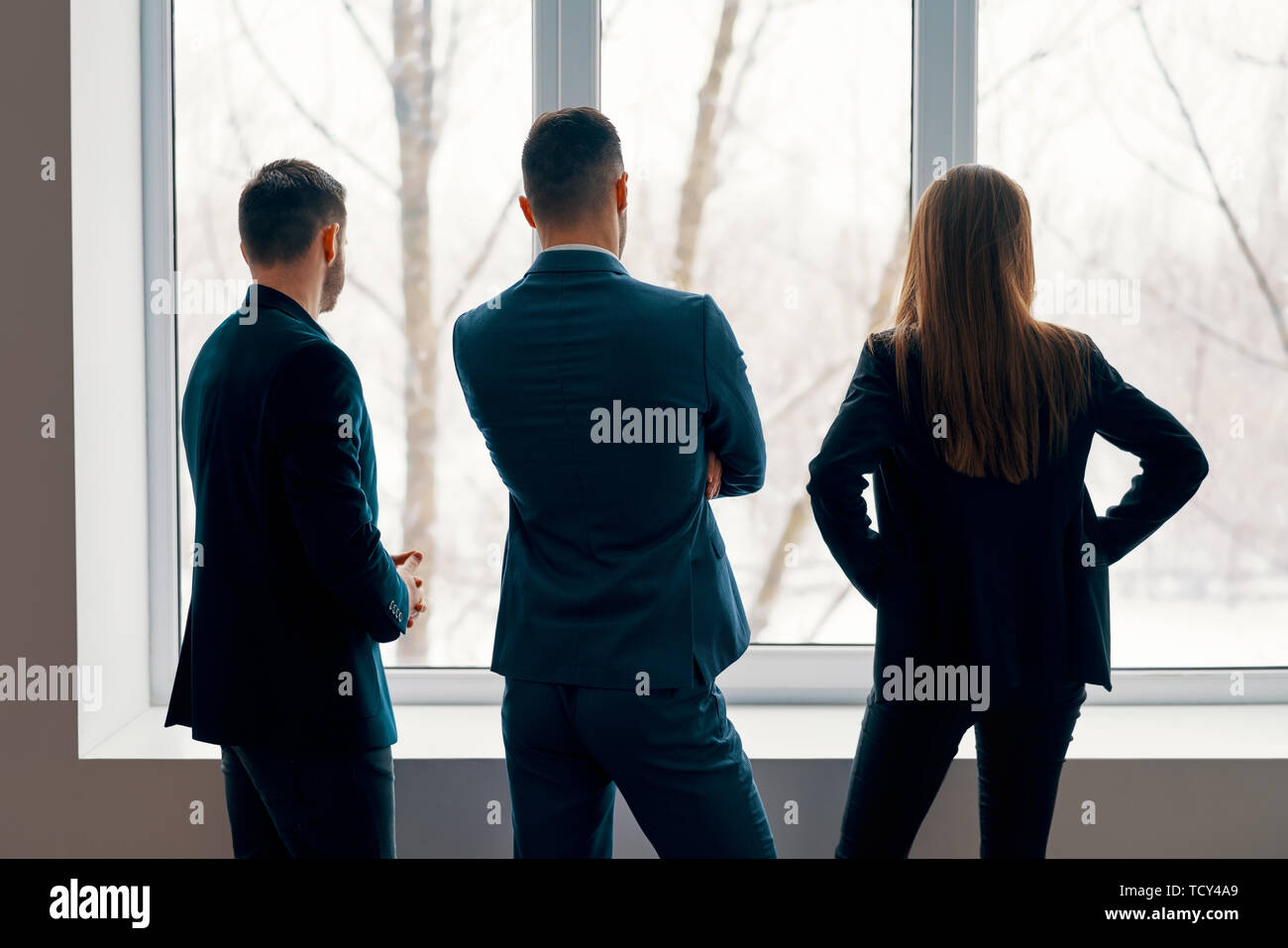 Back view of business people talking during the coffee break stand near ...