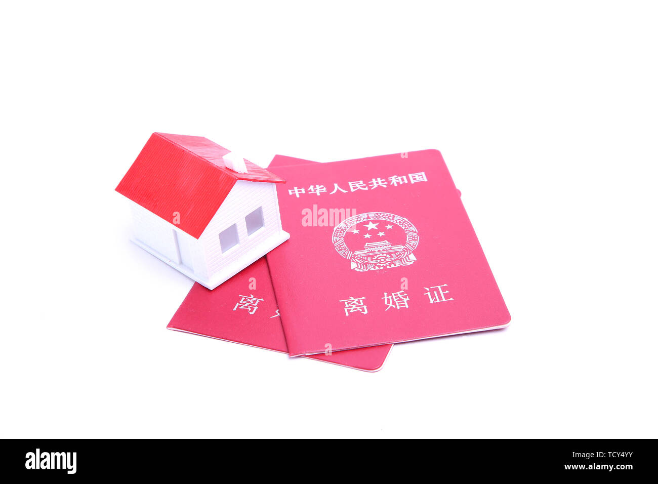 Divorce certificates and house models Stock Photo - Alamy