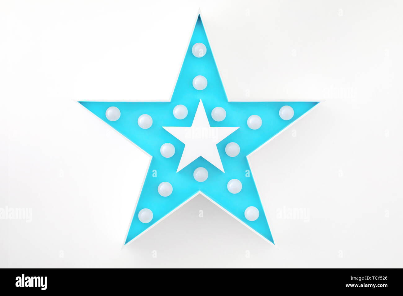 Large blue decorative star with lots of lights on white background ...