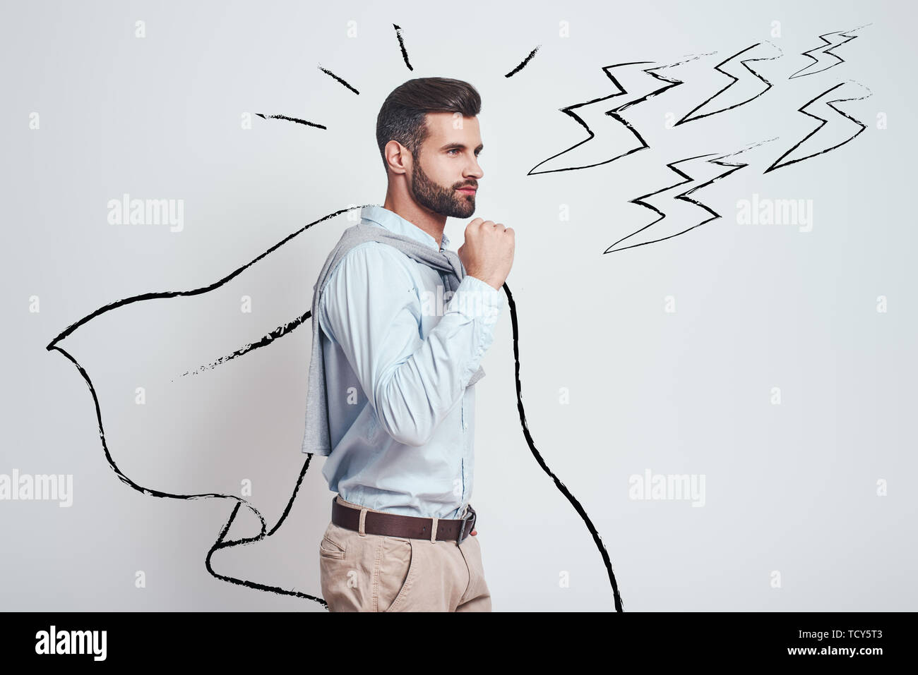 I am enough strong! Confident and attractive young man wearing a drawn ...