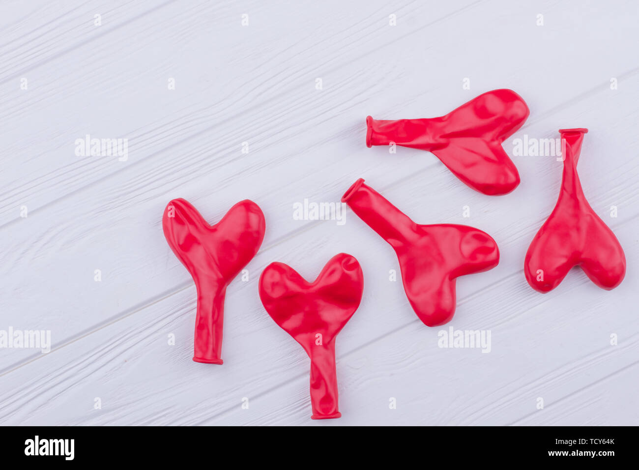 Deflated red balloon hi-res stock photography and images - Alamy
