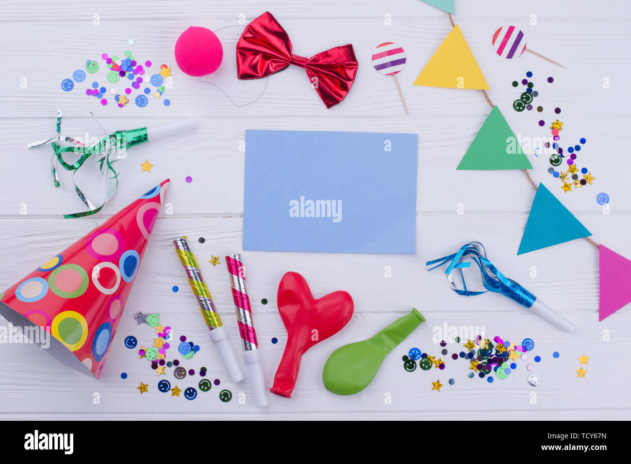 Birthday accessories on white wooden background Stock Photo - Alamy