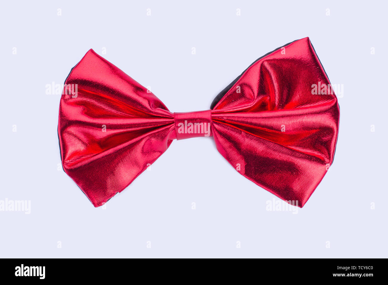 Red shiny bow-tie isolated on white background Stock Photo - Alamy