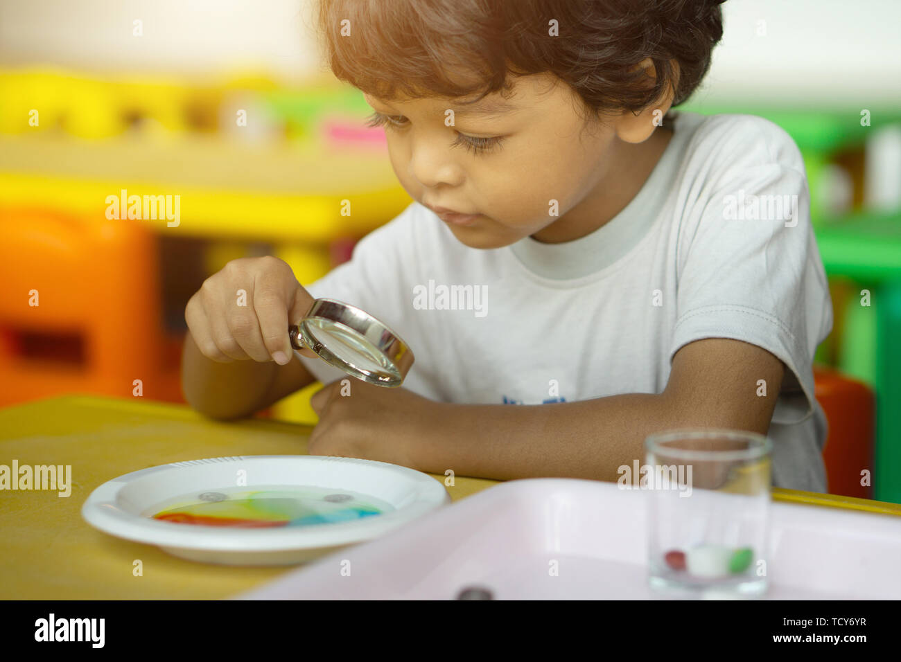 3 year old children in Asia are conducting scientific experiments for ...