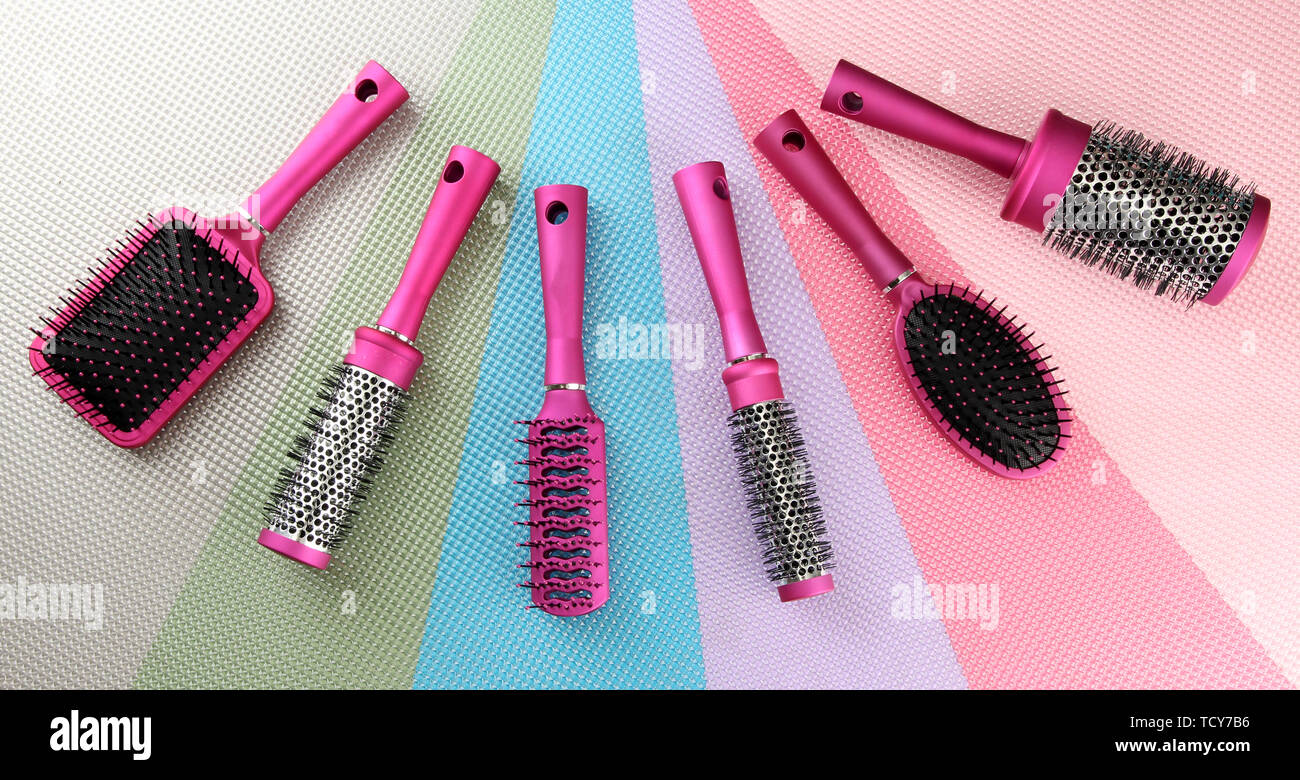 Comb brushes on bright background Stock Photo - Alamy