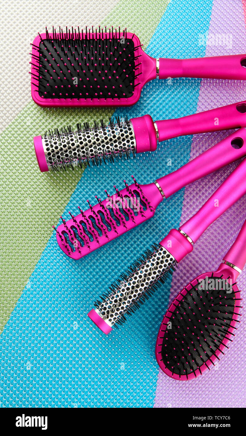 Comb brushes on bright background Stock Photo - Alamy