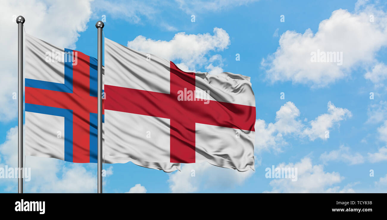 Faroe Islands and England flag waving in the wind against white cloudy ...