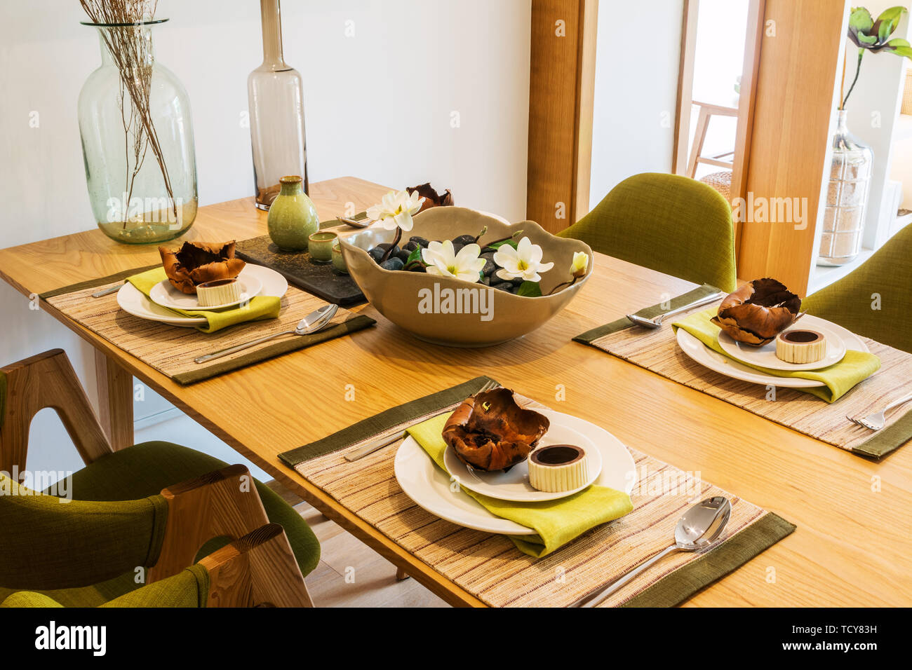 Dinner on table in dining room of villa Stock Photo - Alamy