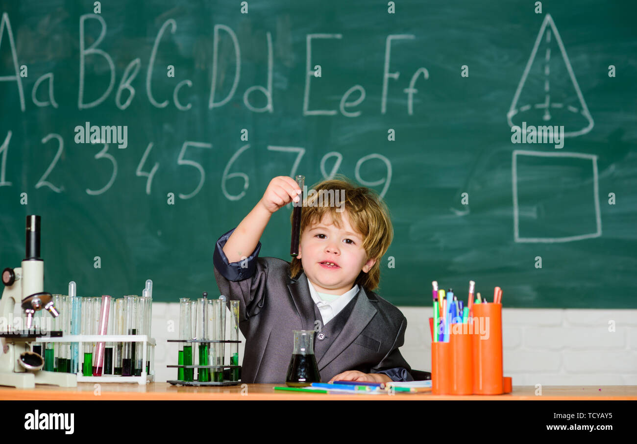 Kid study biology chemistry. Happy childhood. Child enjoy studying. Boy ...