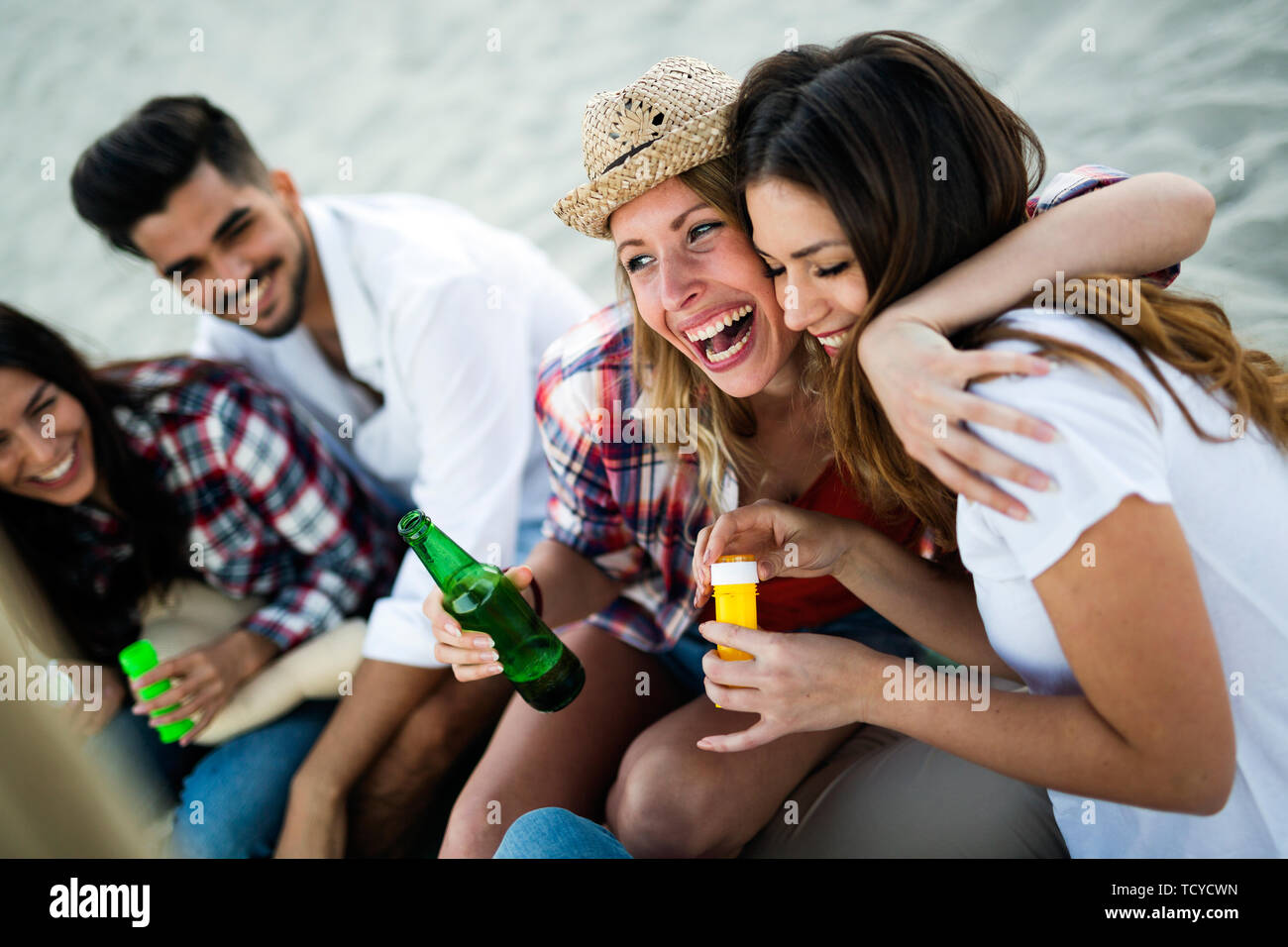 Happy group of young people having fun at beach Stock Photo - Alamy