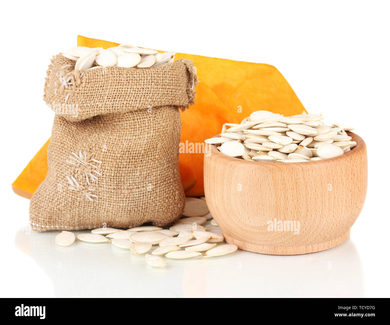 Pumpkin seeds in sack and wooden bowl, isolated on white Stock Photo ...