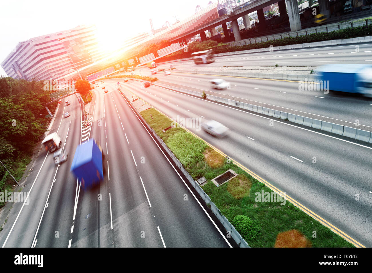 busy traffic on multi highway lanes during sunset Stock Photo - Alamy