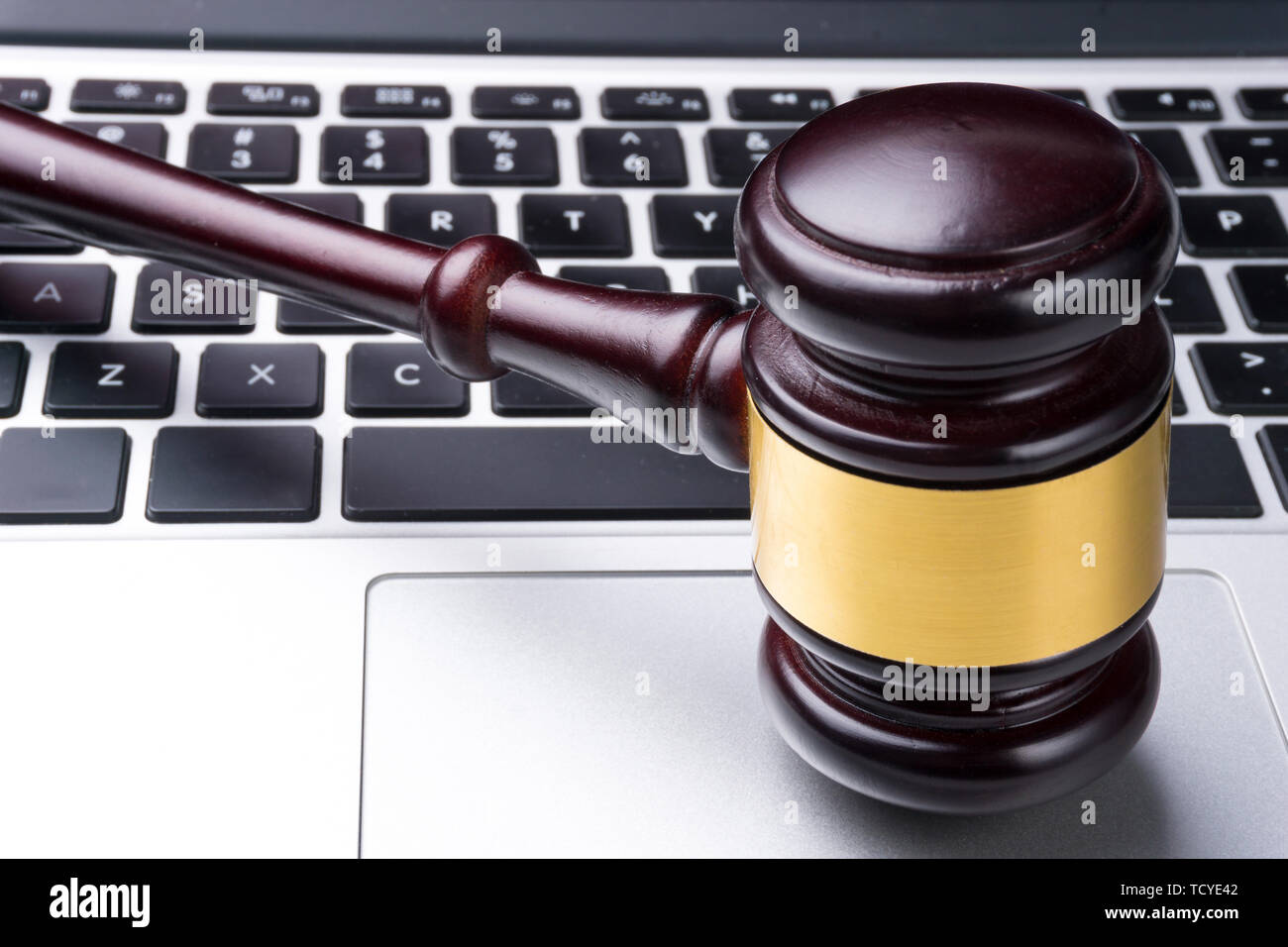 Judge hammer on keyboard Stock Photo - Alamy