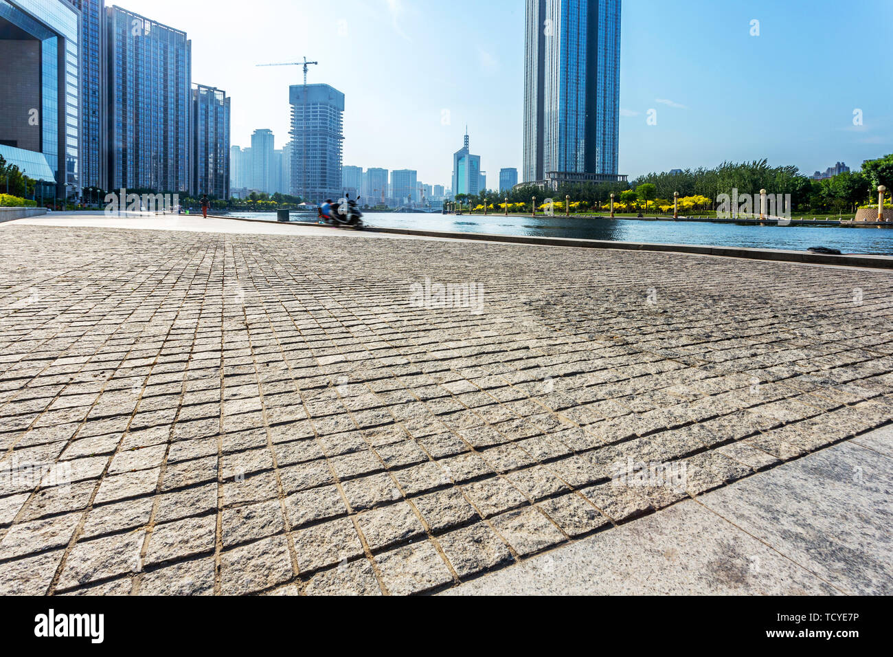 modern building exterior with brick road floor at riverbank Stock Photo ...