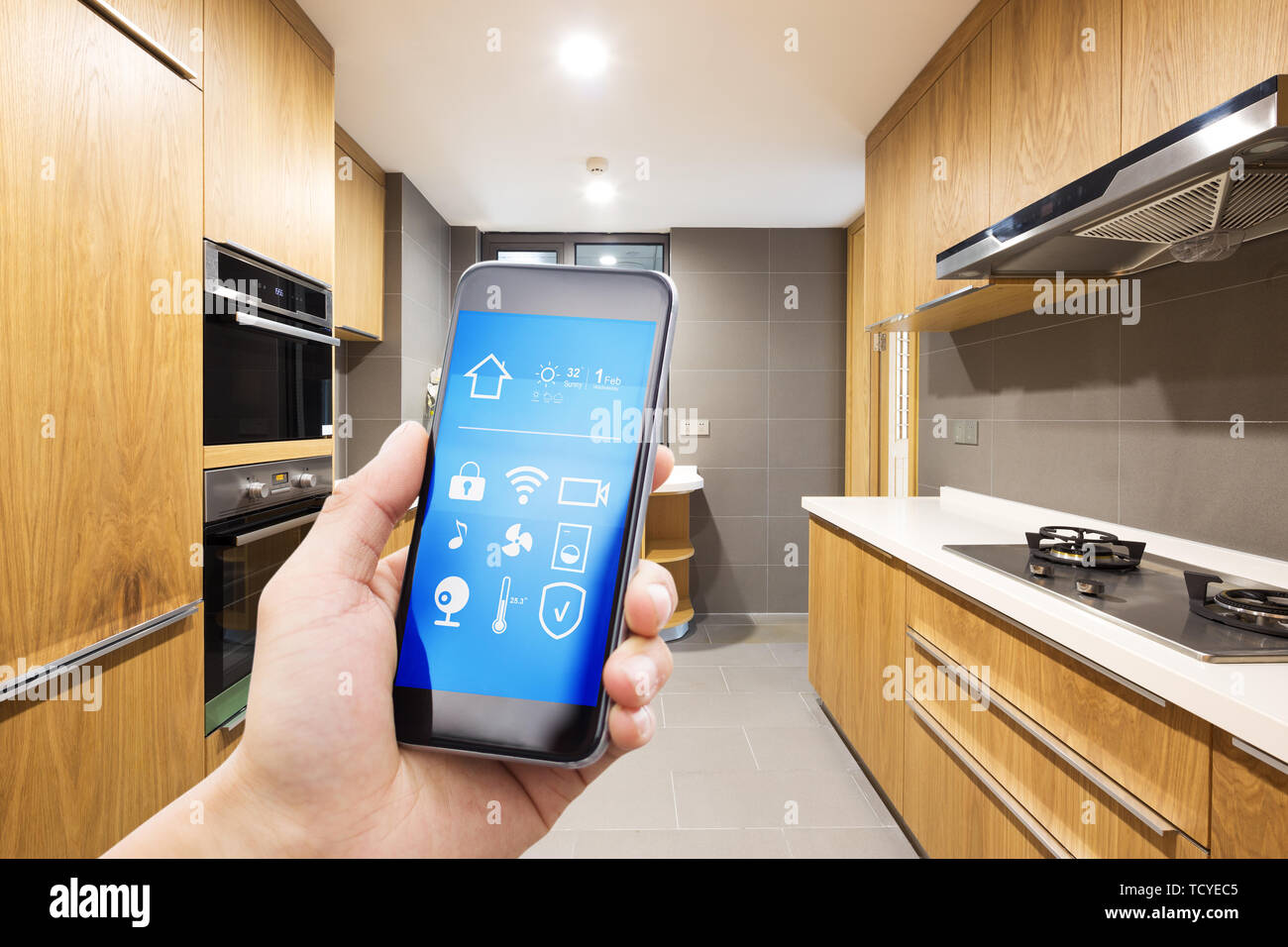 smart phone with smart home with modern kitchen Stock Photo - Alamy