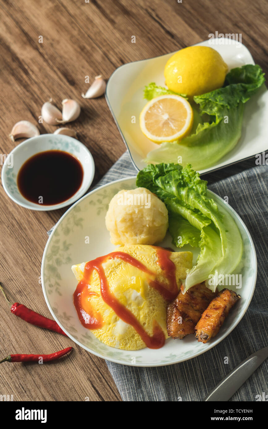 Egg rice with wood pattern background Stock Photo - Alamy