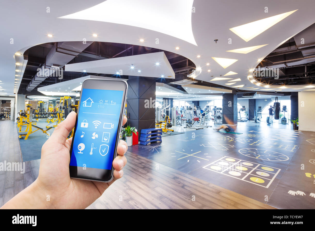 smart phone with smart home with modern gym Stock Photo - Alamy