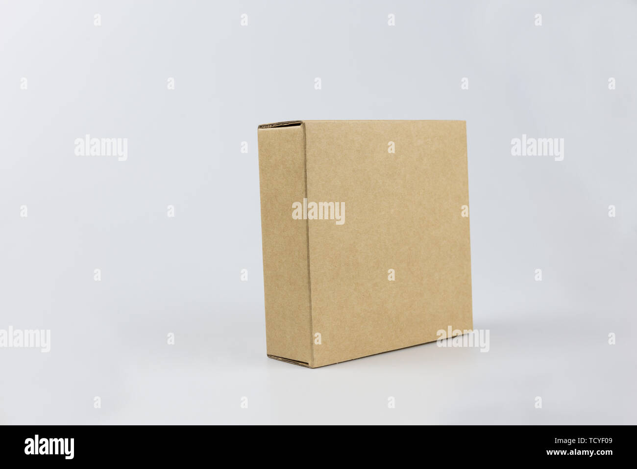 isolated yellow paper box on white background Stock Photo - Alamy