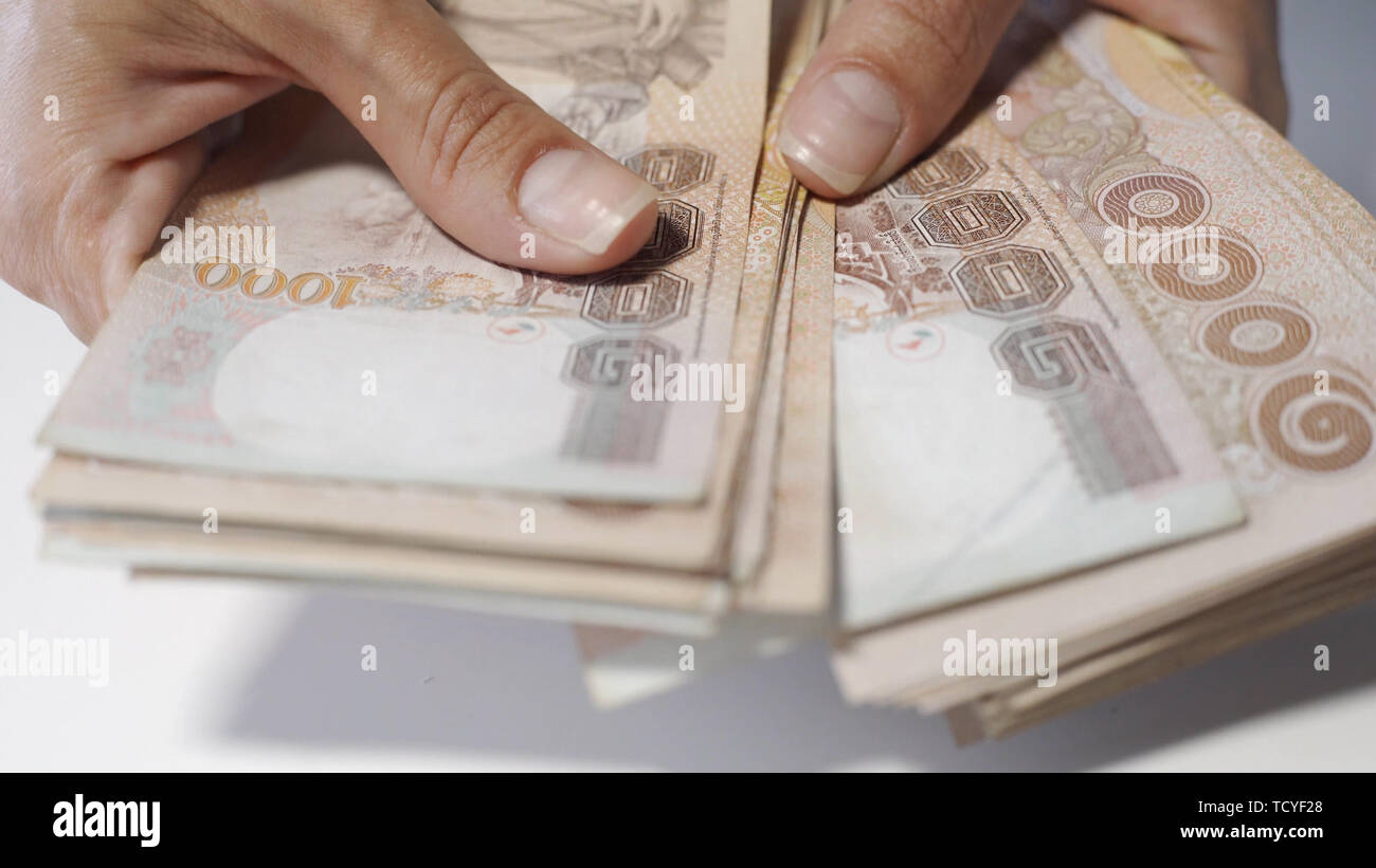 Close up hands counting of thousansds Thai baht money.Close up Human ...
